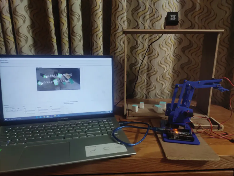 Computer Vision Based Robotic Arm Controlled Using Interactive GUI